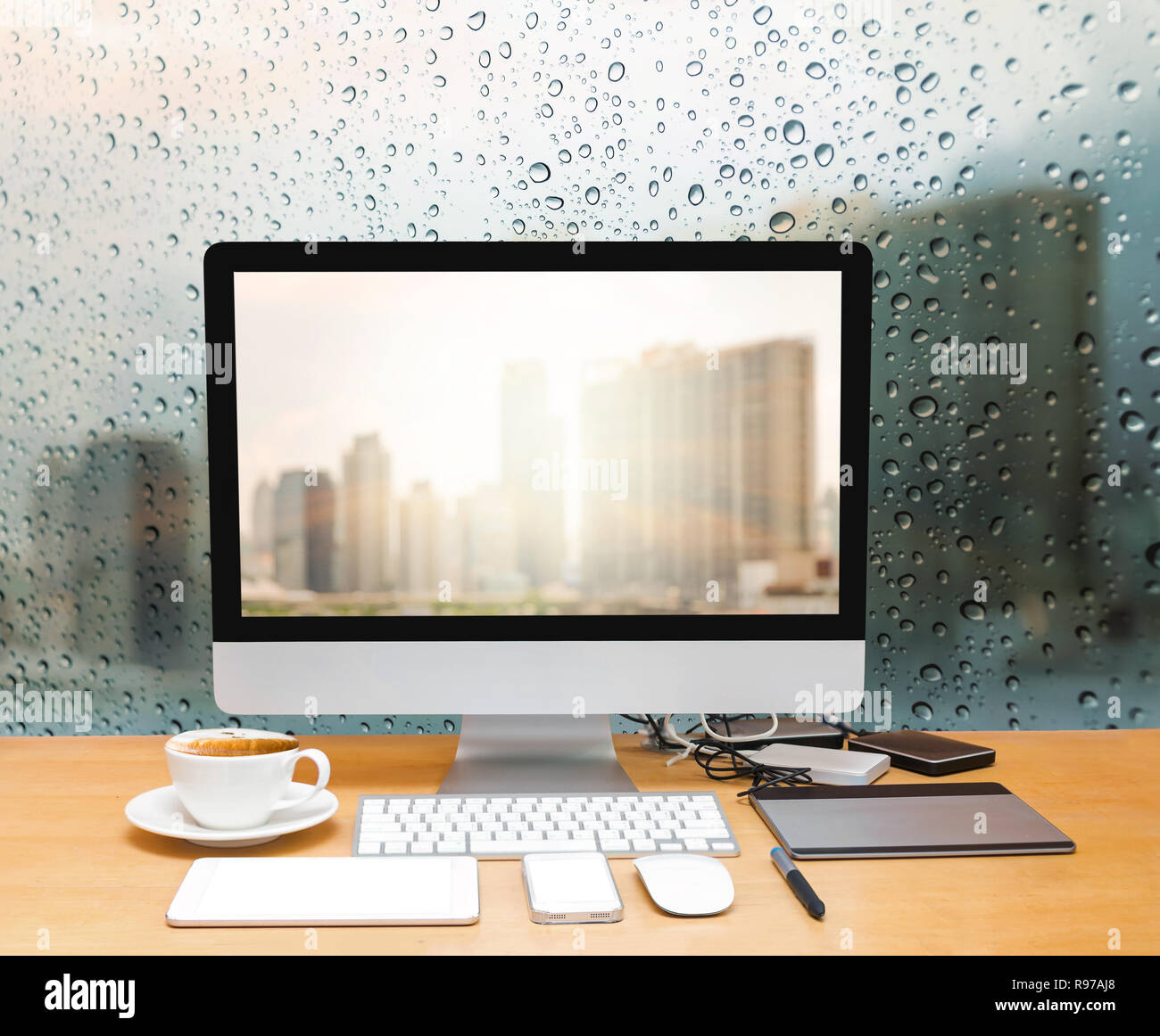 Workspace with computer desktop on the wood table with a glass surface ...