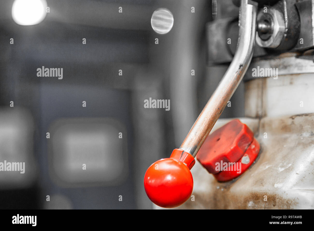 Close-up red new car lift lever in a car repair shop. Apparatus for ...