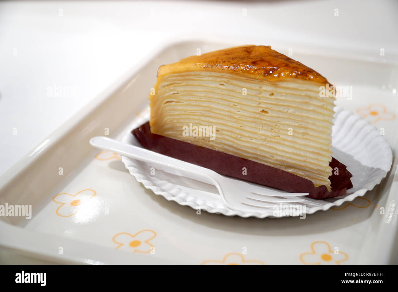 The delicious crepe cake served on the paper plate Stock Photo - Alamy