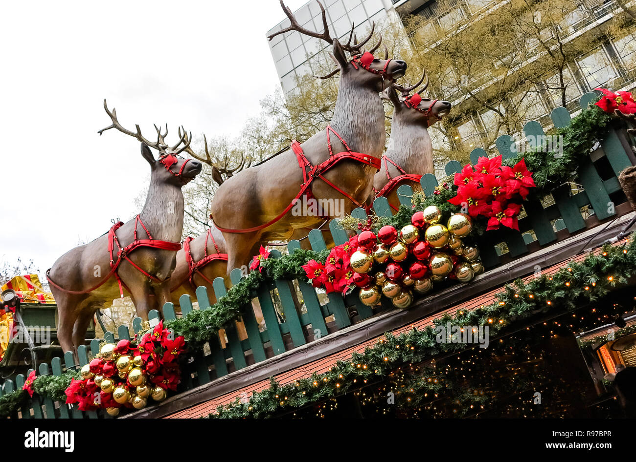 Cologne, Germany - The Christmas Market with huge reindeer sculpture on ...