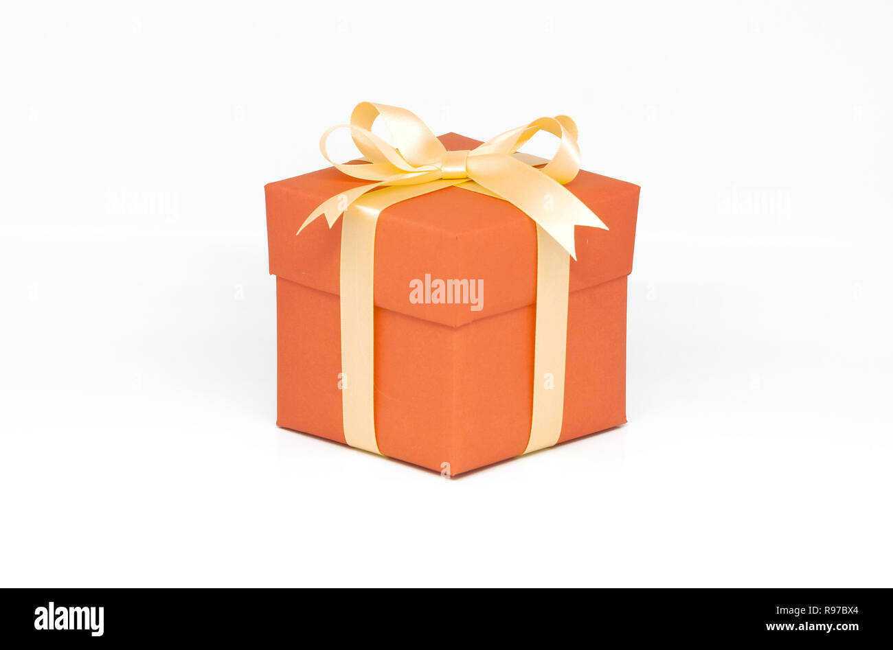 Orange gift box on isolated on white background Stock Photo - Alamy