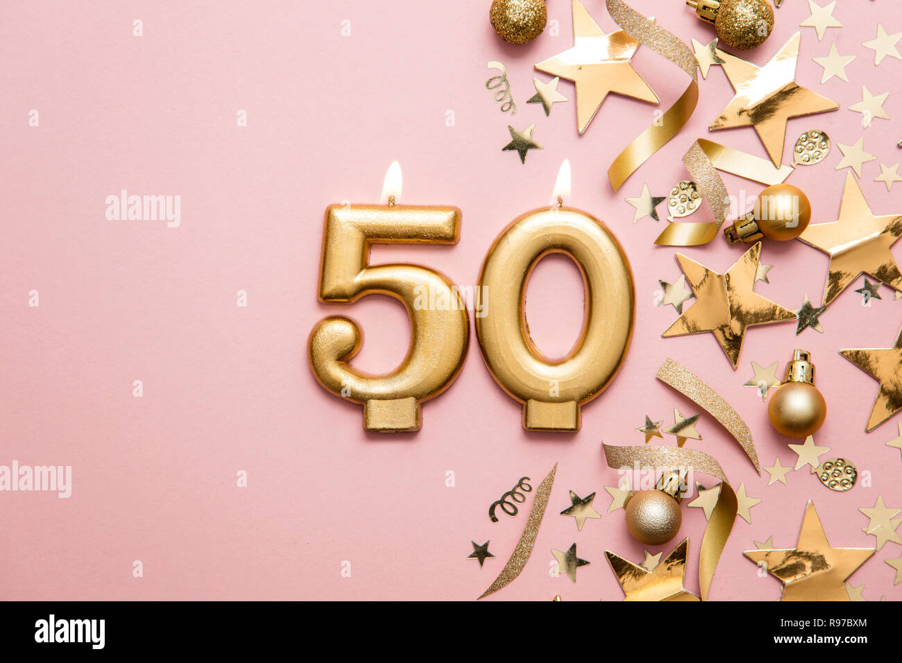Number 50 gold celebration candle on star and glitter background Stock ...