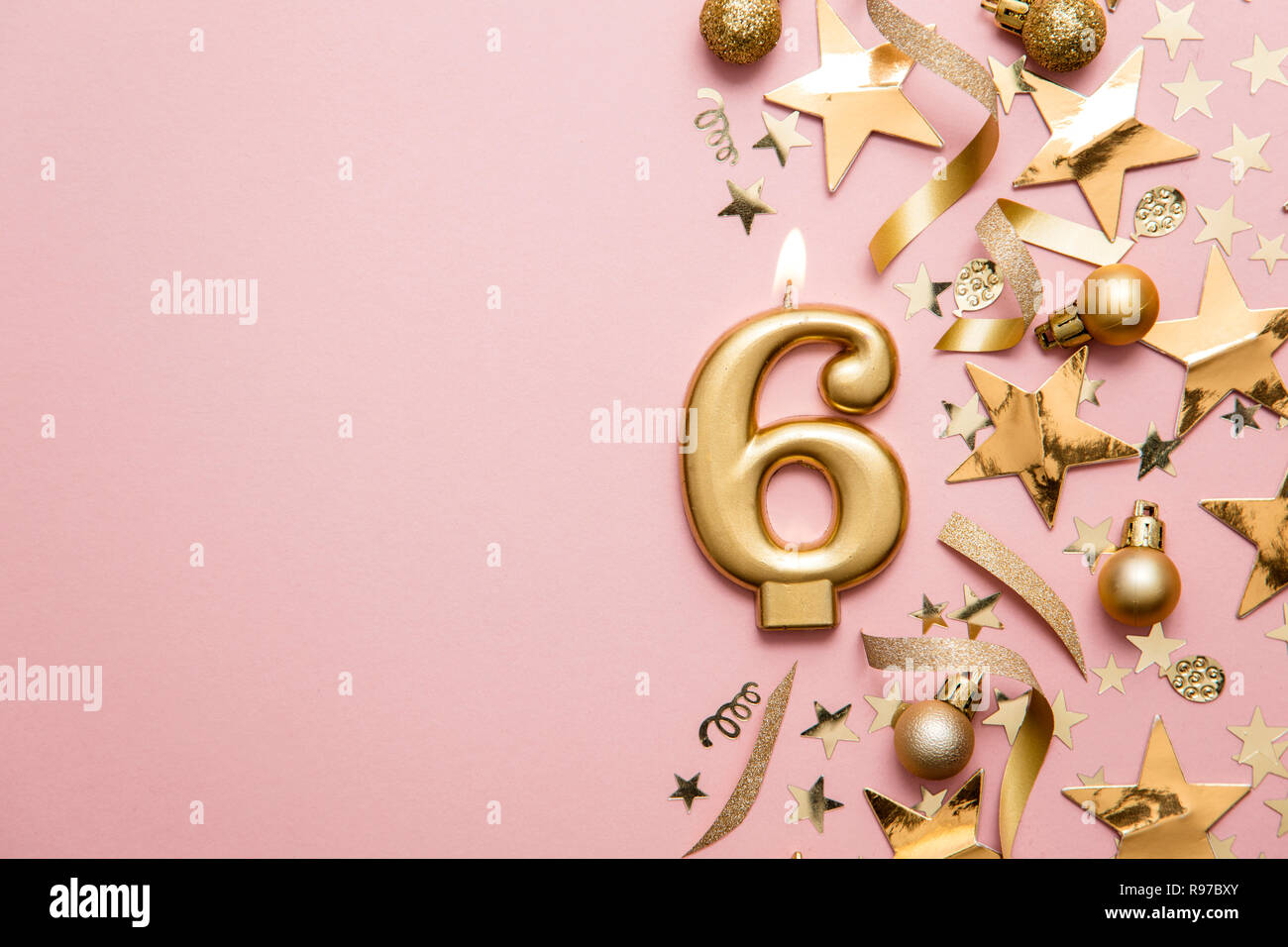 Number 6 gold celebration candle on star and glitter background Stock ...