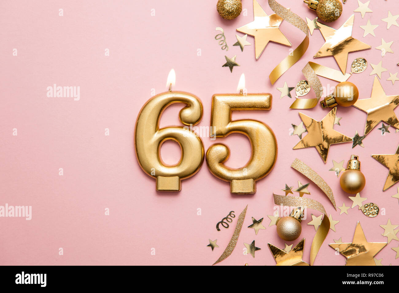 Number 65 gold celebration candle on star and glitter background Stock ...