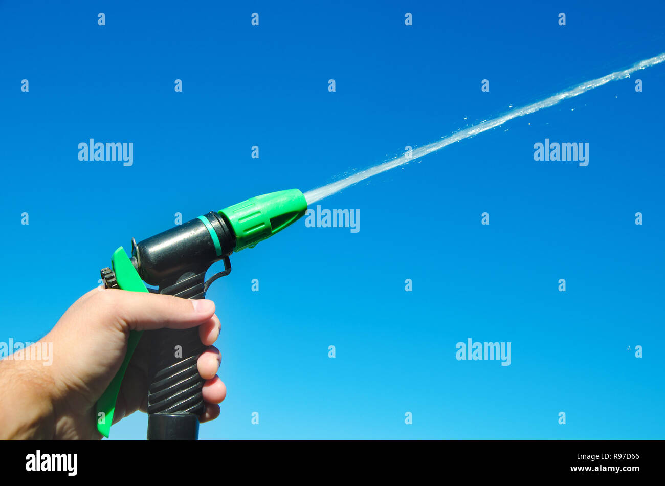 hand with water spray jet Stock Photo - Alamy
