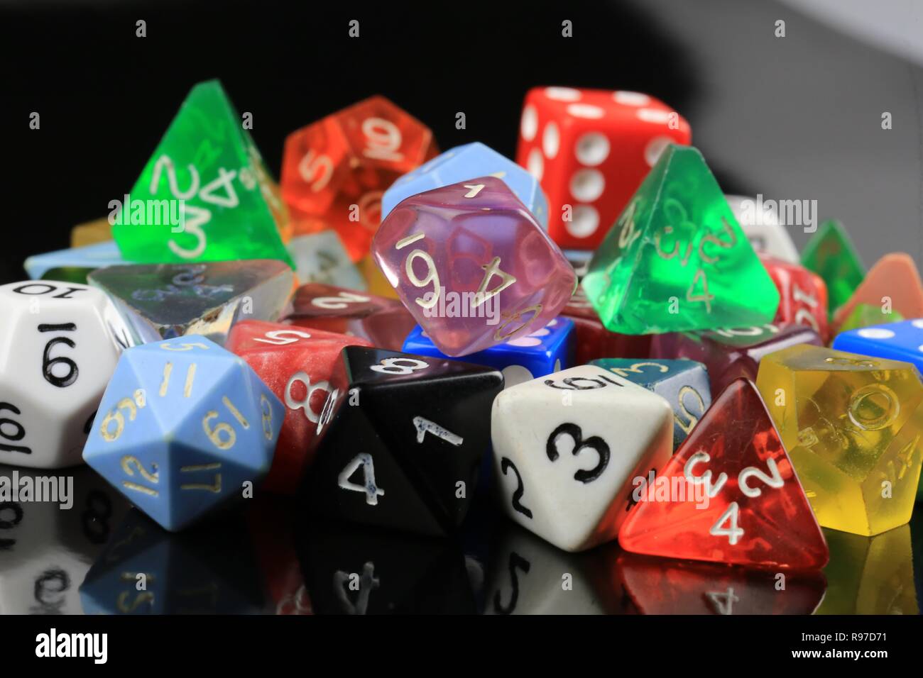 Gaming dice of various size and colors Stock Photo - Alamy