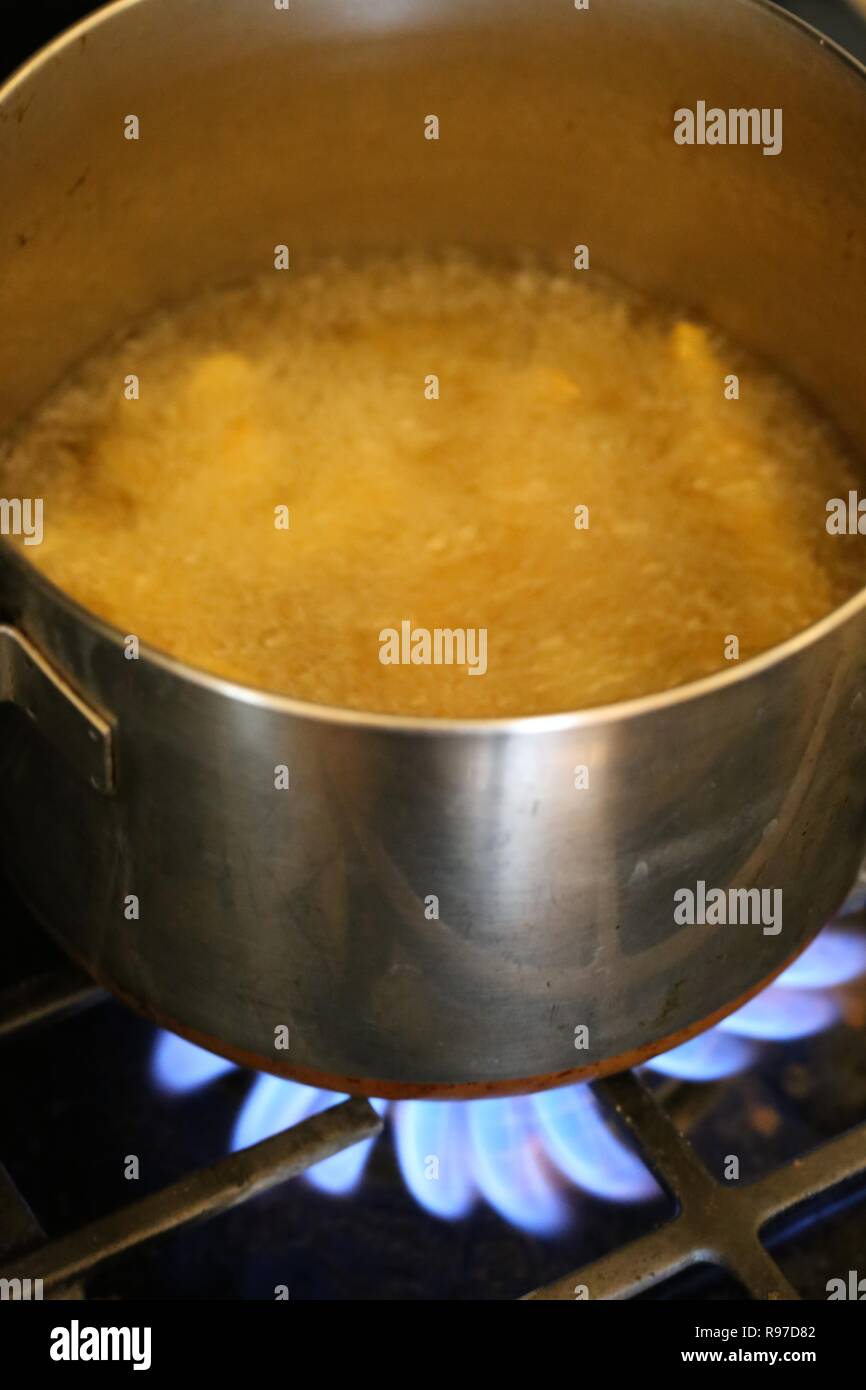 Cooking oil in a pan for deep frying Stock Photo - Alamy