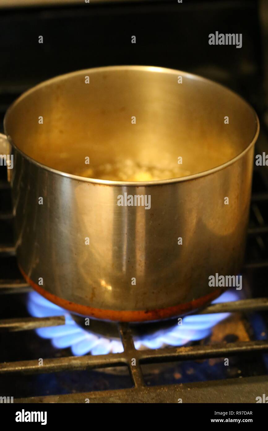 Stovetop pan with frying oil Stock Photo - Alamy