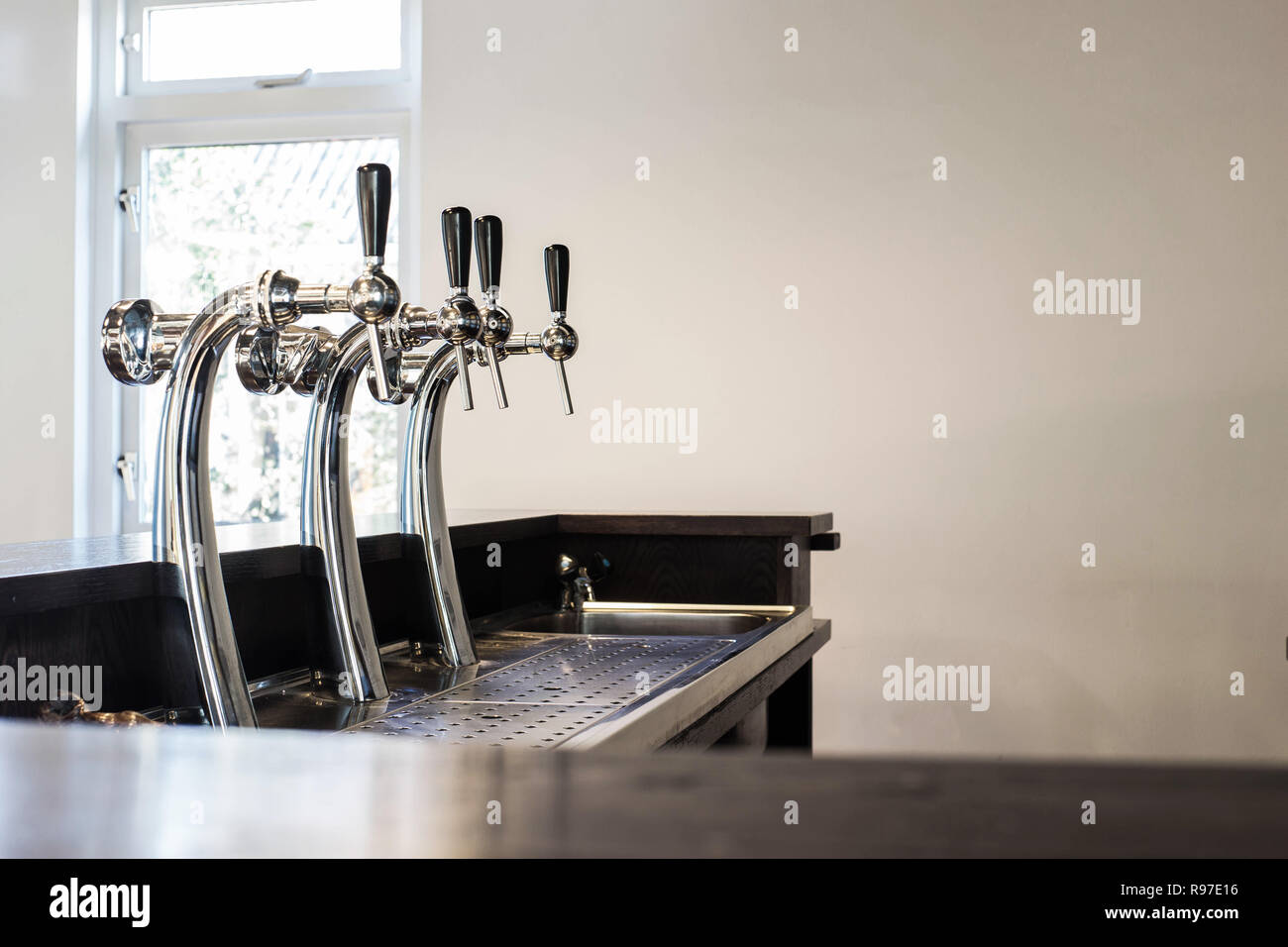 Beer tap in a row close-up in a pub, alcohol concept modern design ...