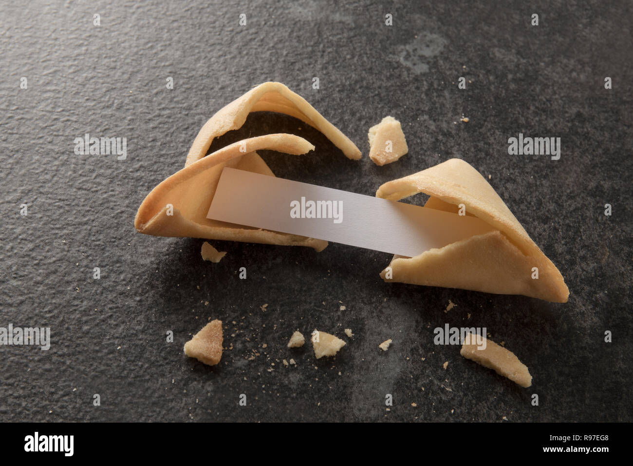 chinese fortune cookies, one is cracked with blank paper slip for the ...