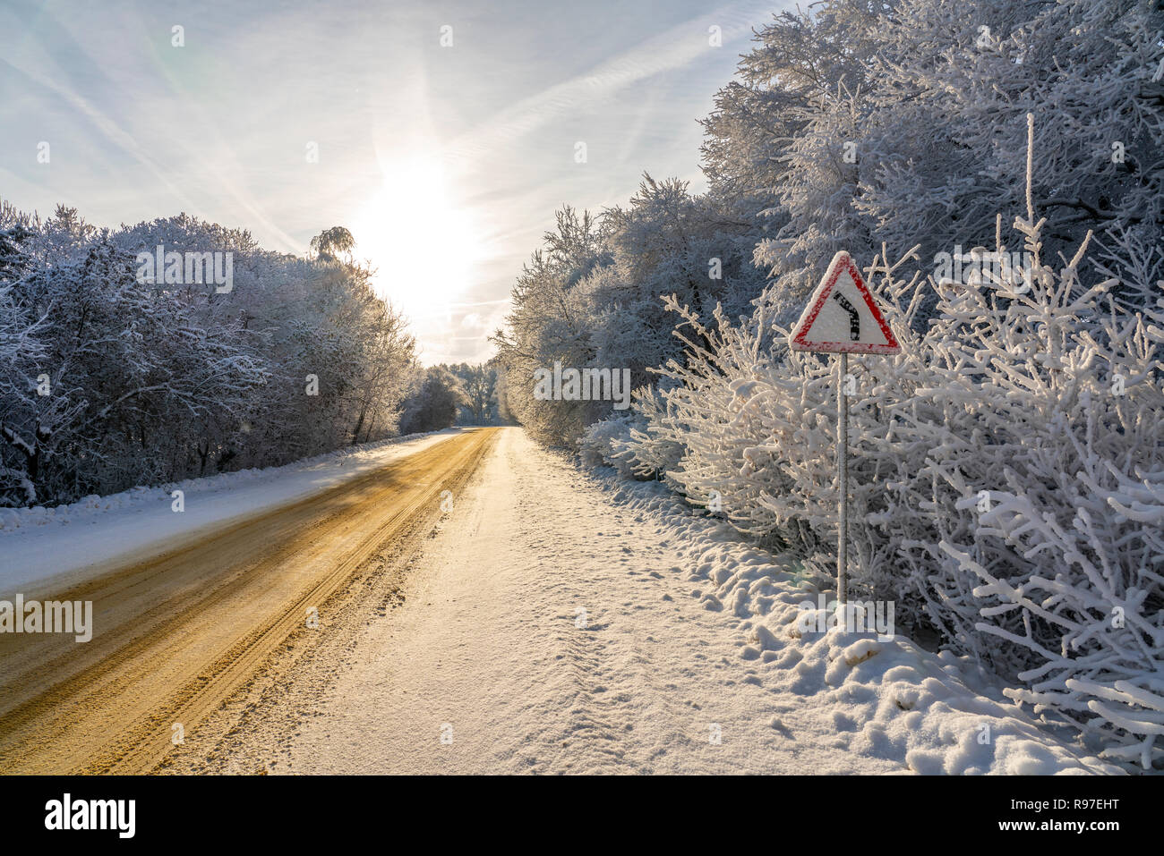 Traffic sign turn right on snowy road. Horizontal image. Background ...