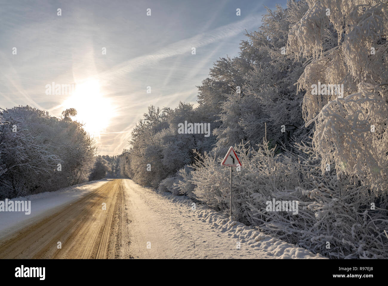 Traffic sign turn right on snowy road. Horizontal image. Background ...