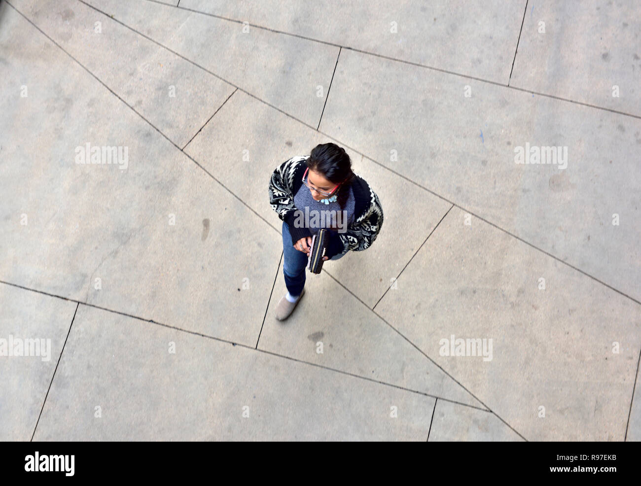 Looking down from high angle on one pedestrian walking Stock Photo - Alamy