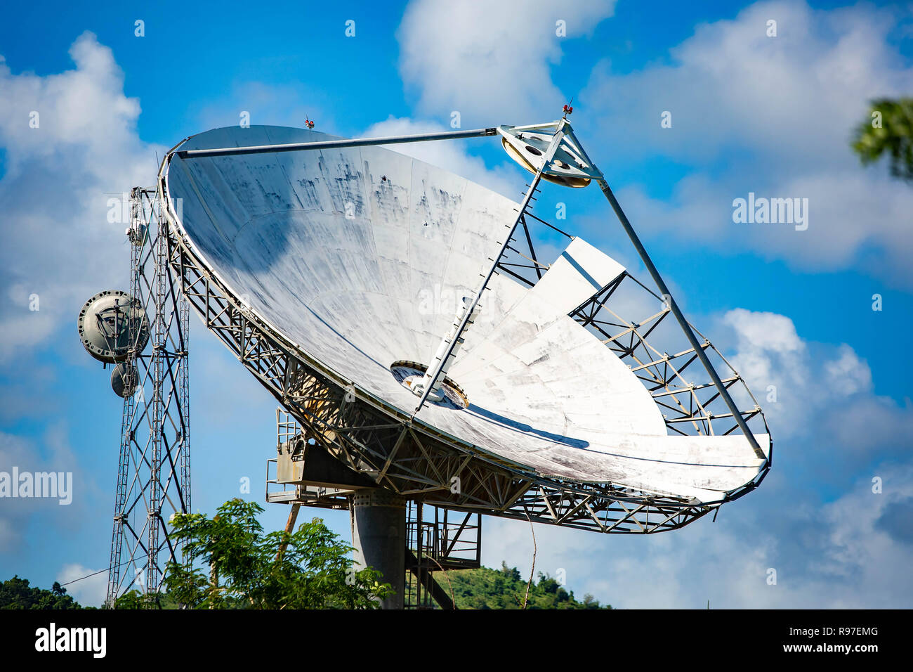 Satellite dish in the forest with sighns of rust at day Stock Photo - Alamy