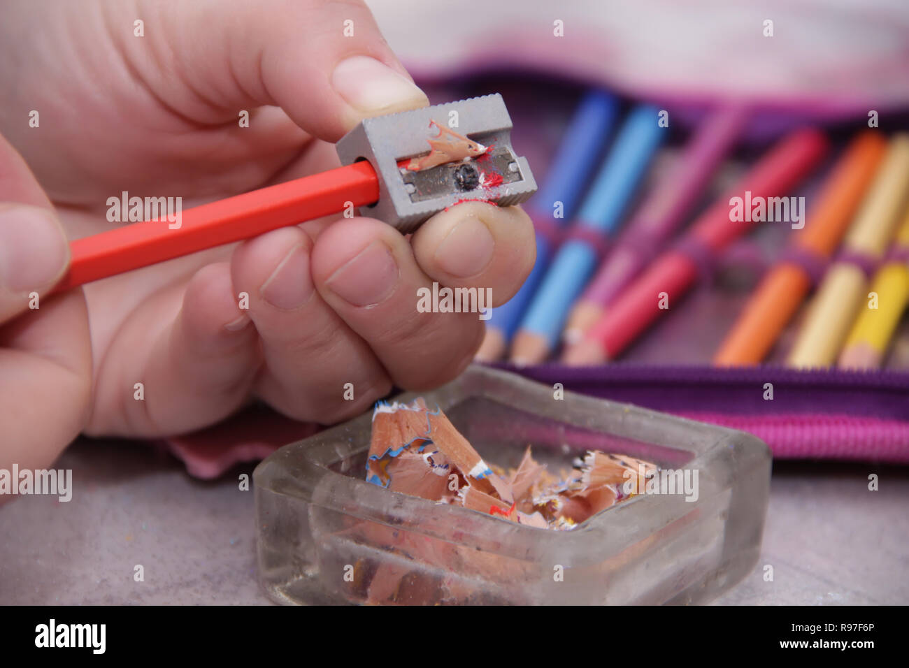 Woman sharpening wooden crayons Stock Photo - Alamy