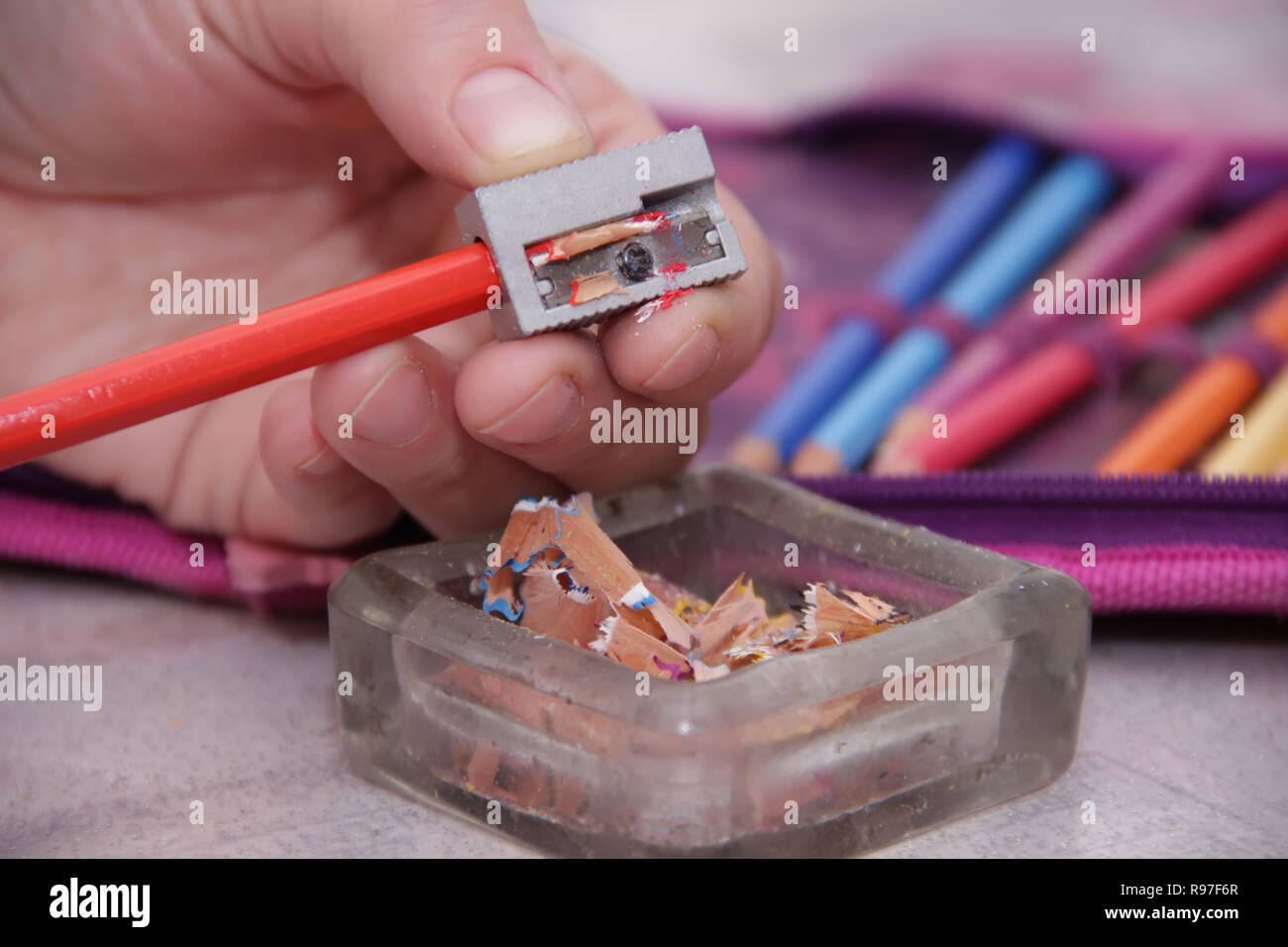 Woman sharpening wooden crayons Stock Photo - Alamy