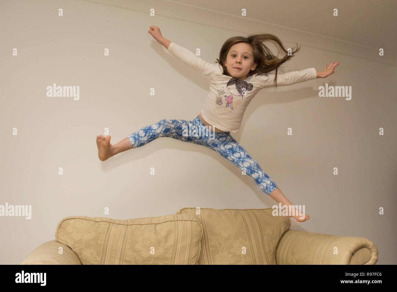 Six year old girl jumping hi-res stock photography and images - Alamy