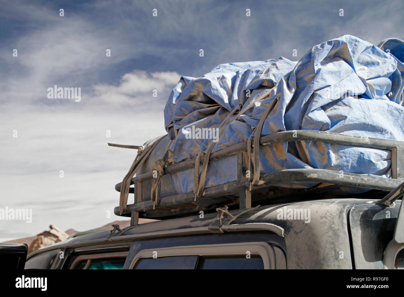 Off-road vehicle covered in sand after a storm in Uyuni, Bolivia Stock ...
