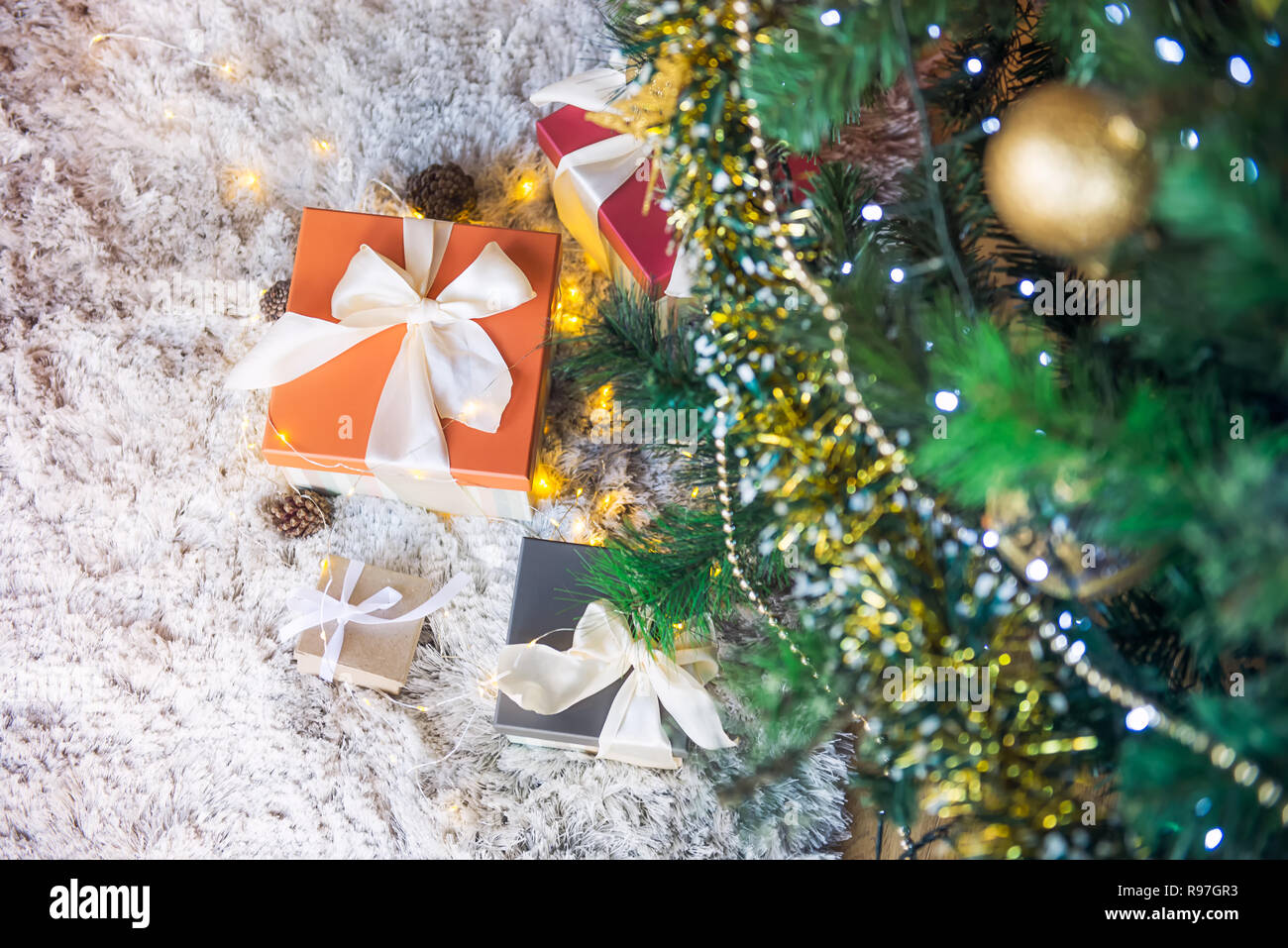 Top view composition of present boxes in colorful festive wrapping tied ...