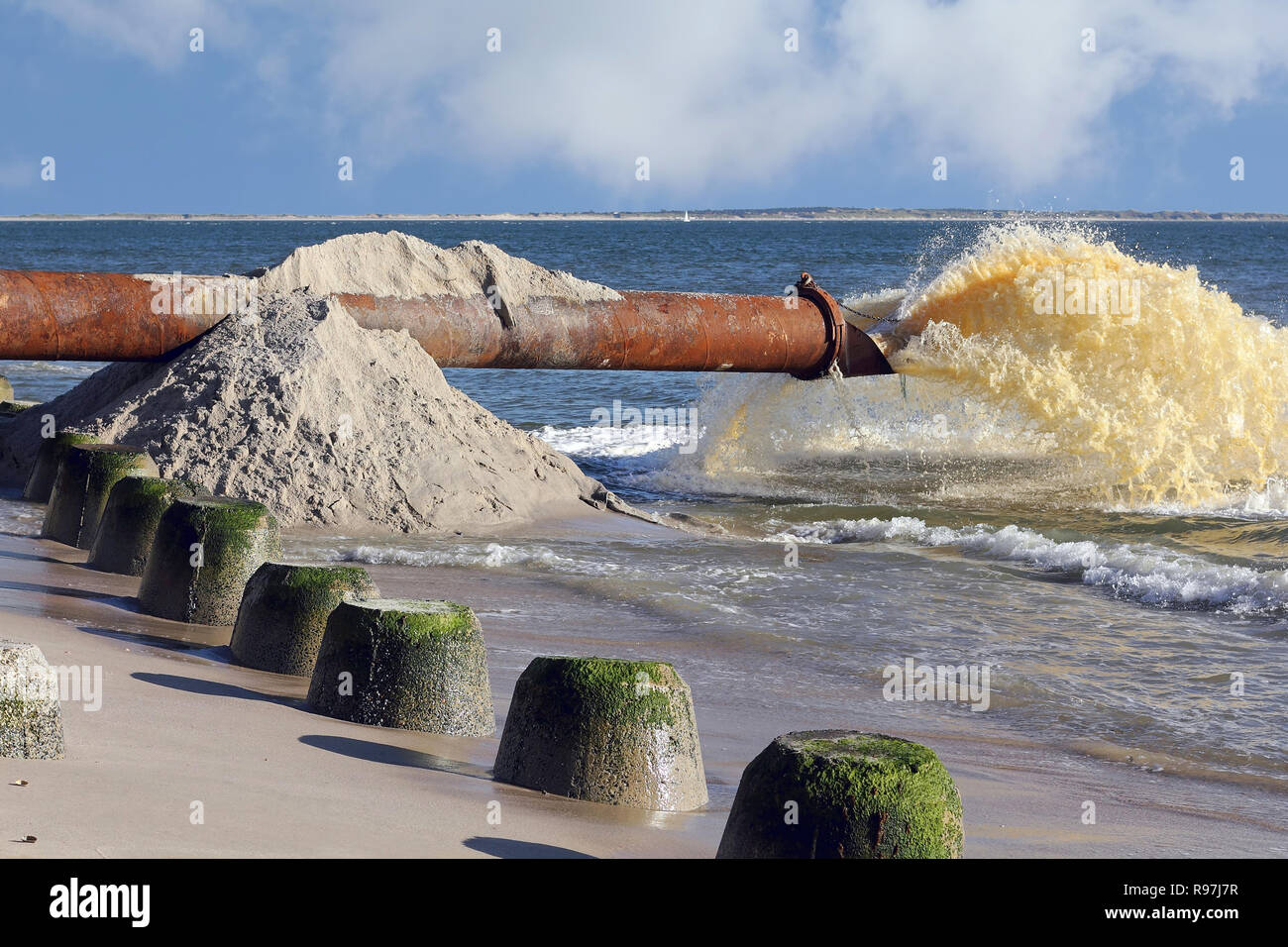 Sand replenishment for the coast protection on the North sea island of ...