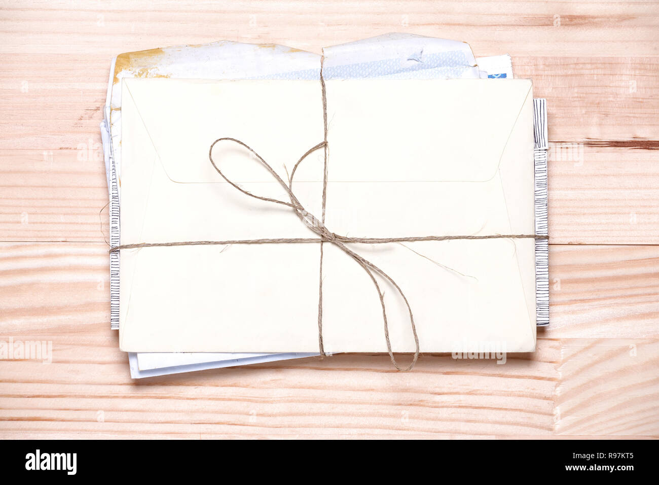 Bunch of vintage letters on a light wooden background. Abstract of ...