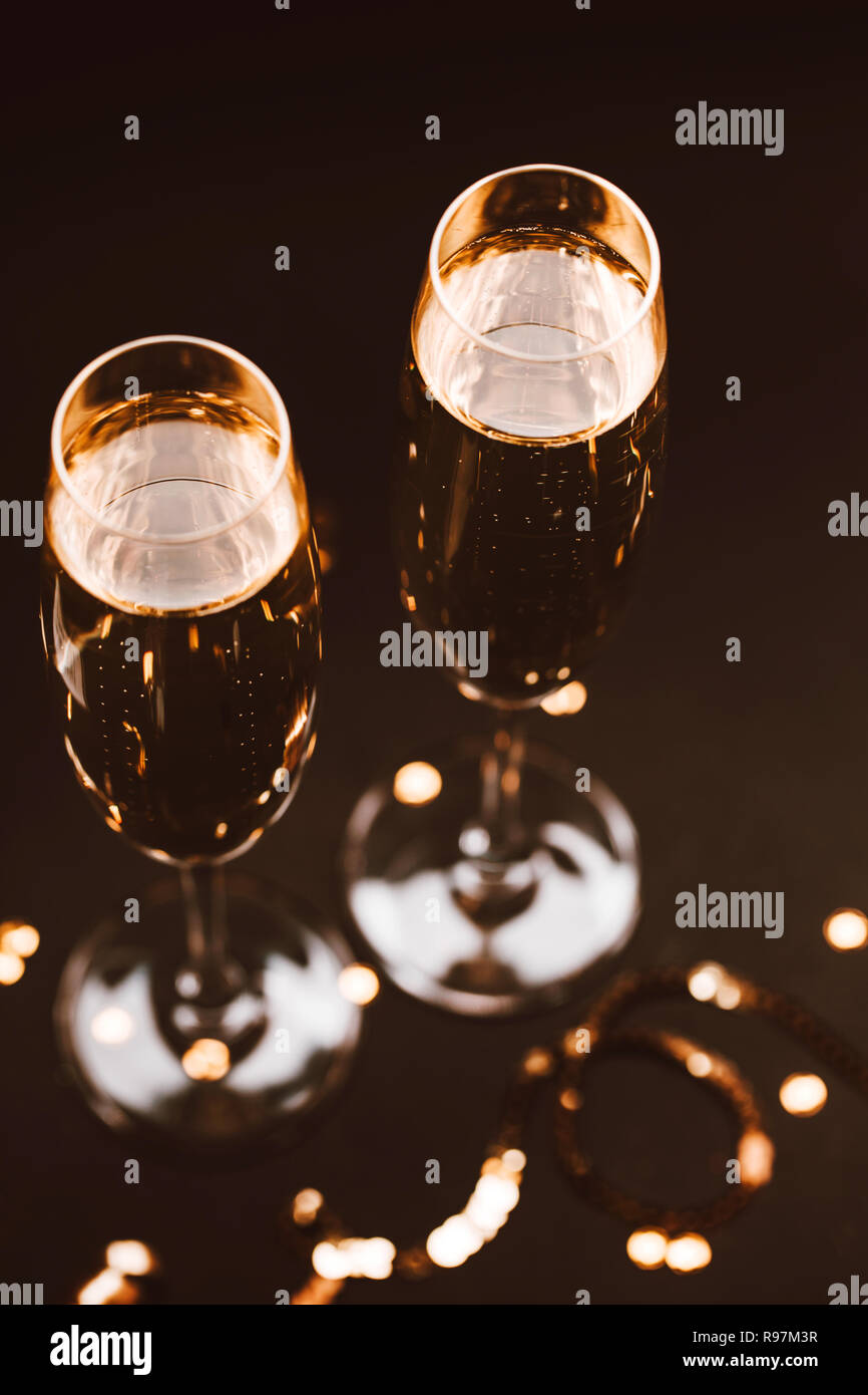Two glasses of champagne with decoration on black elegant background ...
