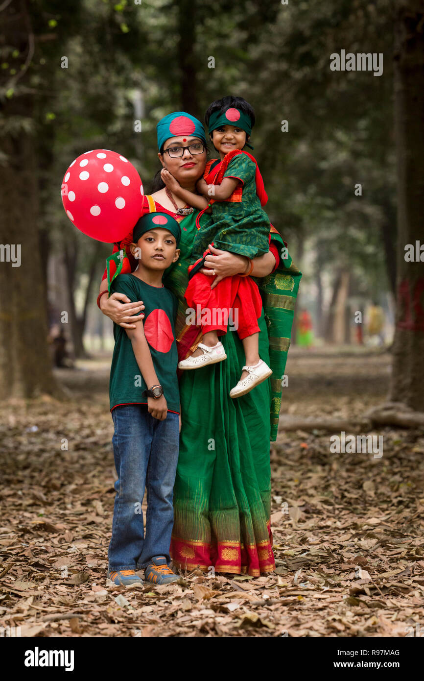 DHAKA, BANGLADESH - DECEMBER 16 : A mother wth her child poses for ...