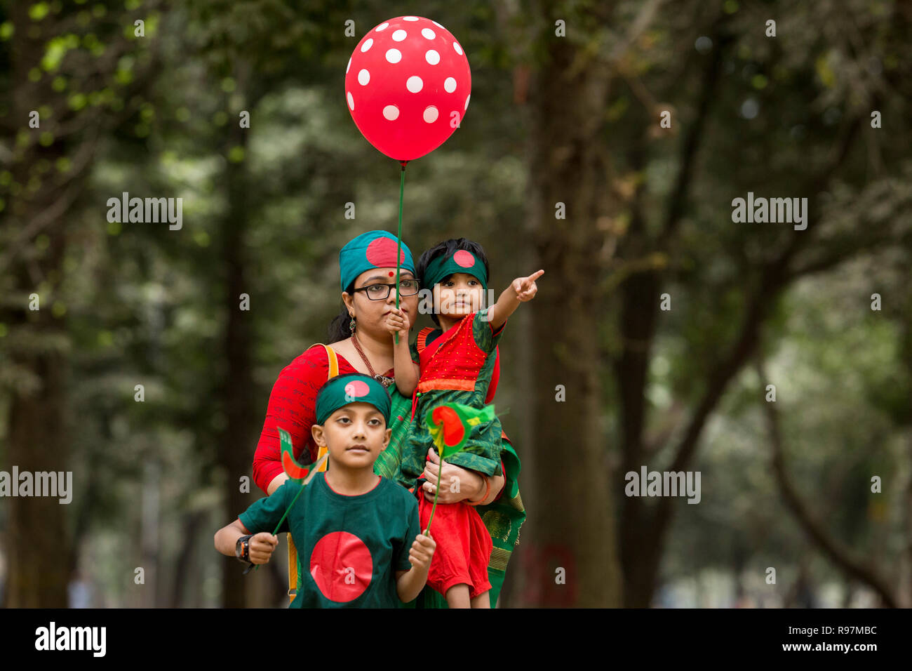DHAKA, BANGLADESH - DECEMBER 16 : A mother wth her child poses for ...