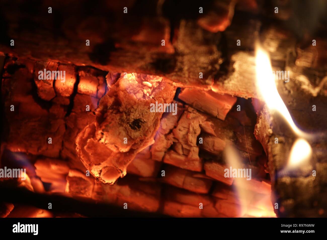 Cozy fire burning in a fireplace Stock Photo - Alamy