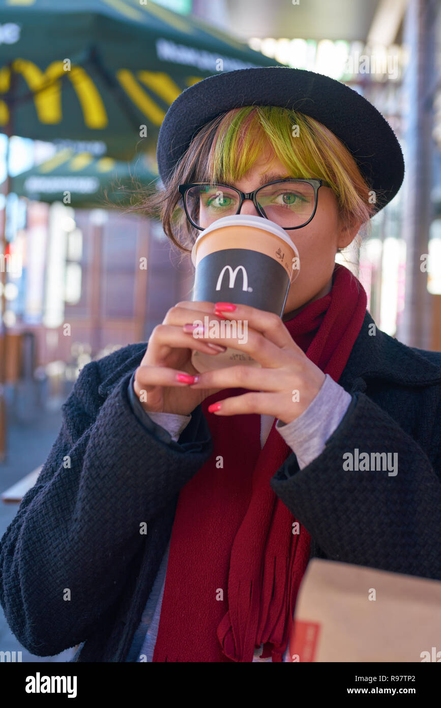 KALININGRAD, RUSSIA - CIRCA APRIL, 2018: young woman with coffee from ...