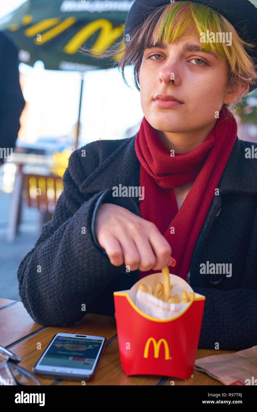 KALININGRAD, RUSSIA - CIRCA APRIL, 2018: caucasian woman eats at ...