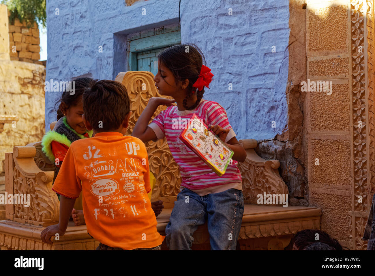 Older sister teaching siblings Stock Photo - Alamy