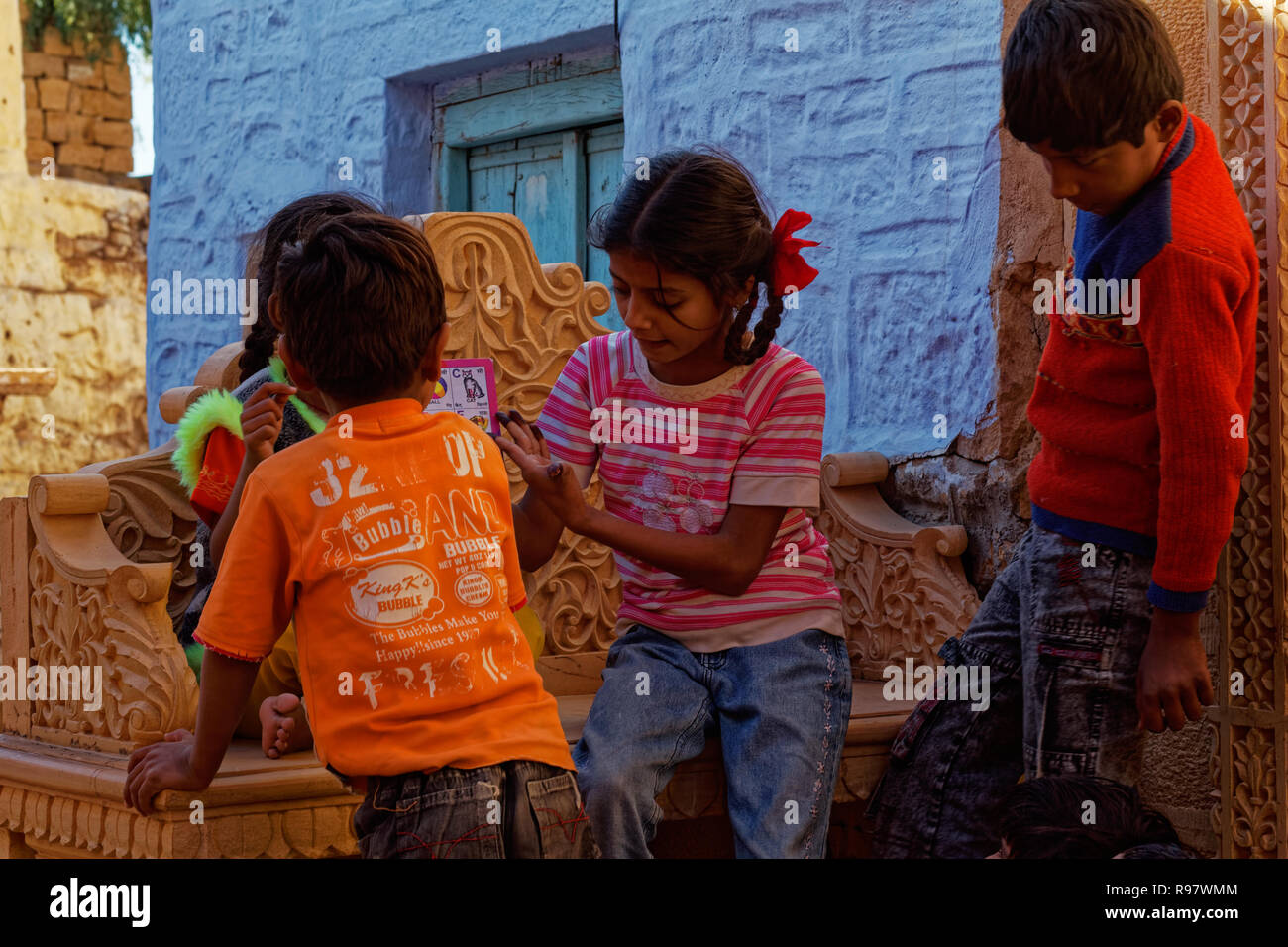 Older sister teaching siblings Stock Photo - Alamy