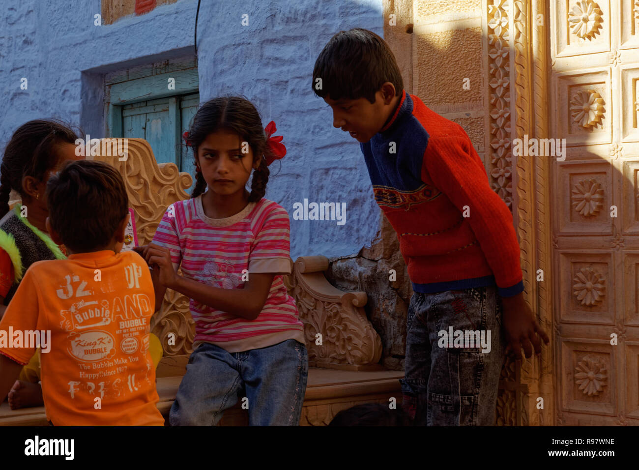 Older sister teaching siblings Stock Photo - Alamy