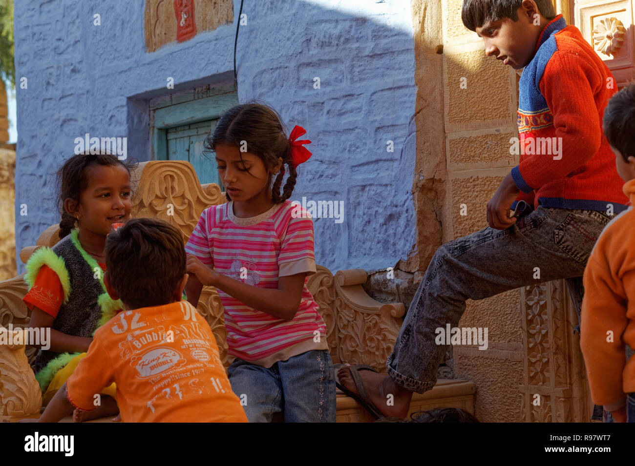 Older sister teaching siblings Stock Photo - Alamy