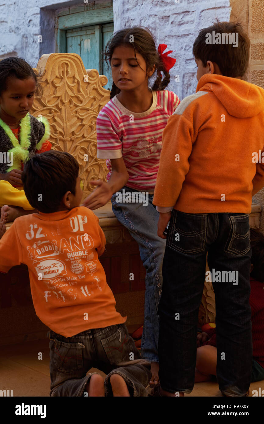 Older sister teaching siblings Stock Photo - Alamy