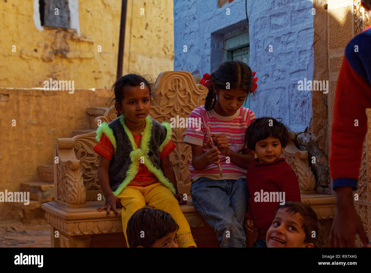 Older sister teaching siblings Stock Photo - Alamy