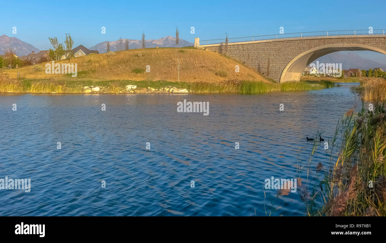 Shiny water and arched bridge in Oquirrh Lake Stock Photo - Alamy