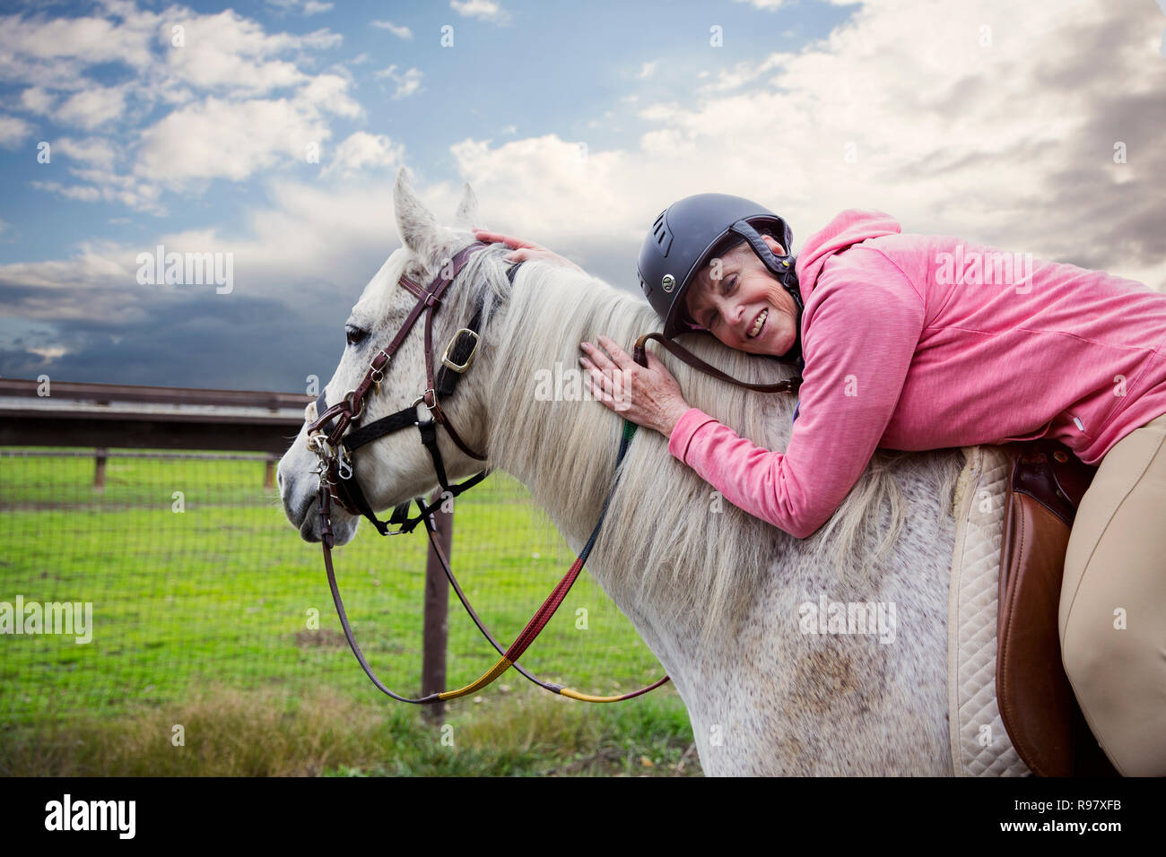 Mature woman riding horse hi-res stock photography and images - Alamy