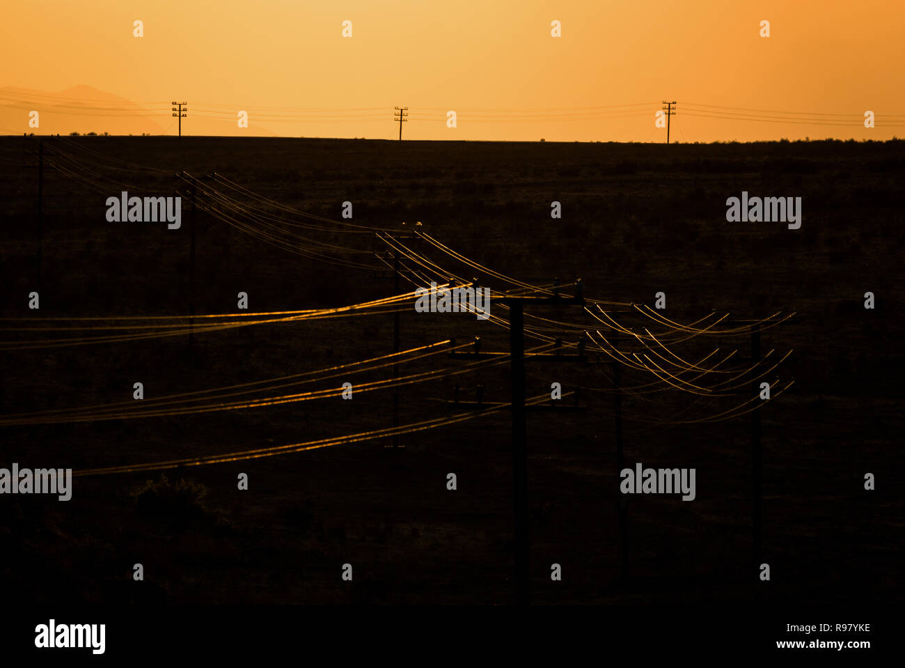 An electricity pylon of the National Grid in Wales at sunset Stock ...