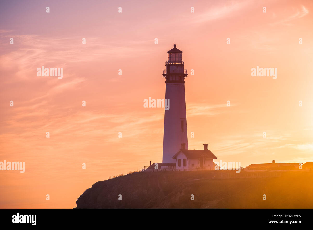 Pigeon Point Lighthouse historical building bathed in sunset light ...