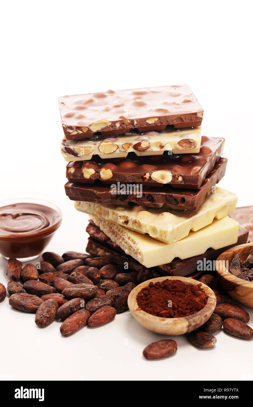 Chocolate bars on table with chocolate tower. Chocolate and nuts Stock ...