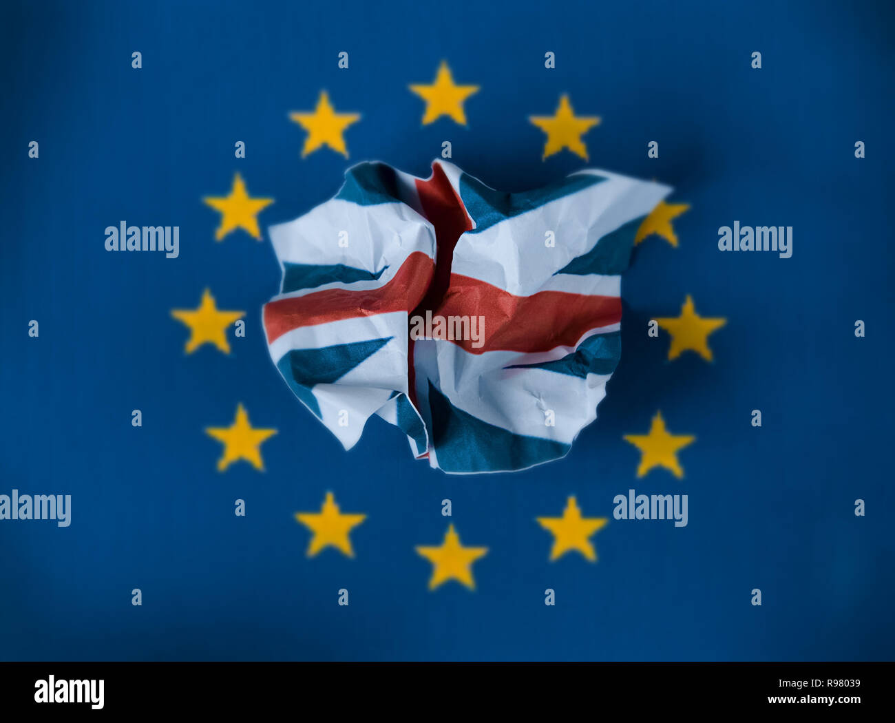 The UK symbol, crumpled in the middle of the EU symbol Stock Photo - Alamy