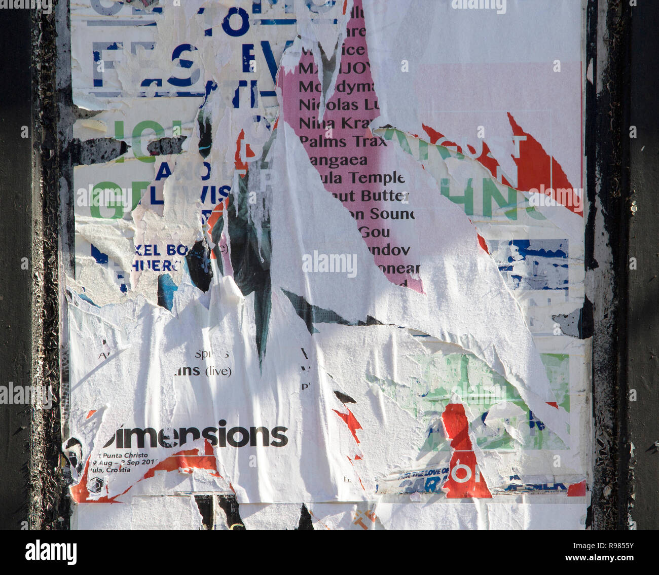 Torn posters on billboard Stock Photo - Alamy