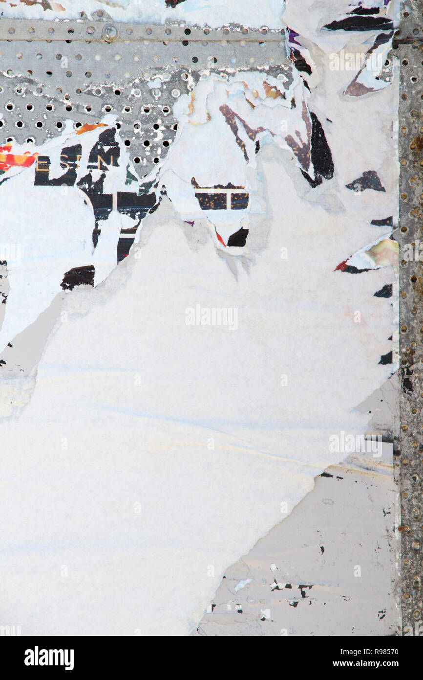 Torn posters on billboard Stock Photo - Alamy
