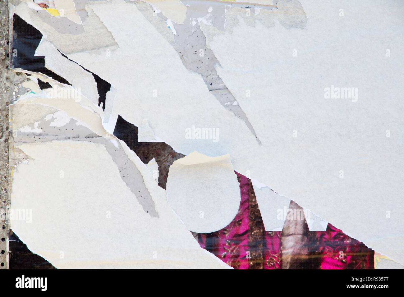 Torn posters on billboard Stock Photo - Alamy