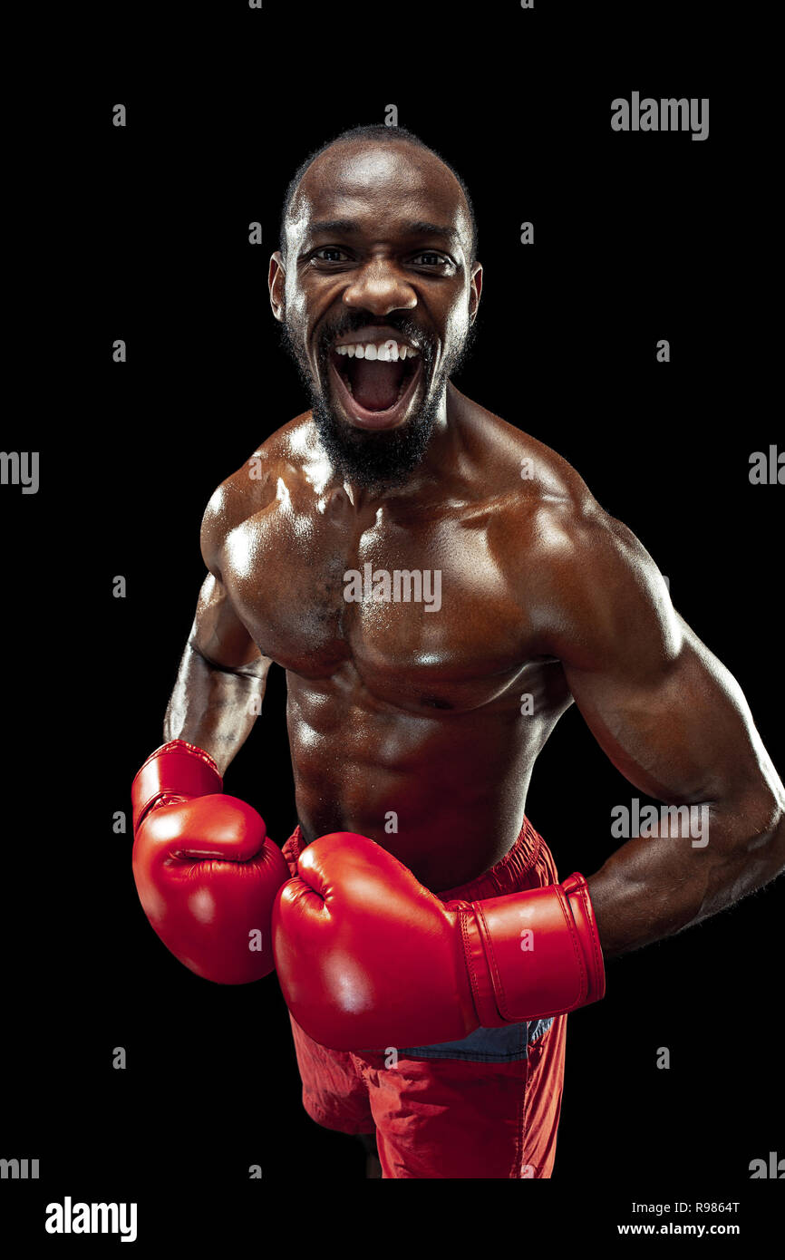 Hands of boxer over black background. Strength, attack and motion ...