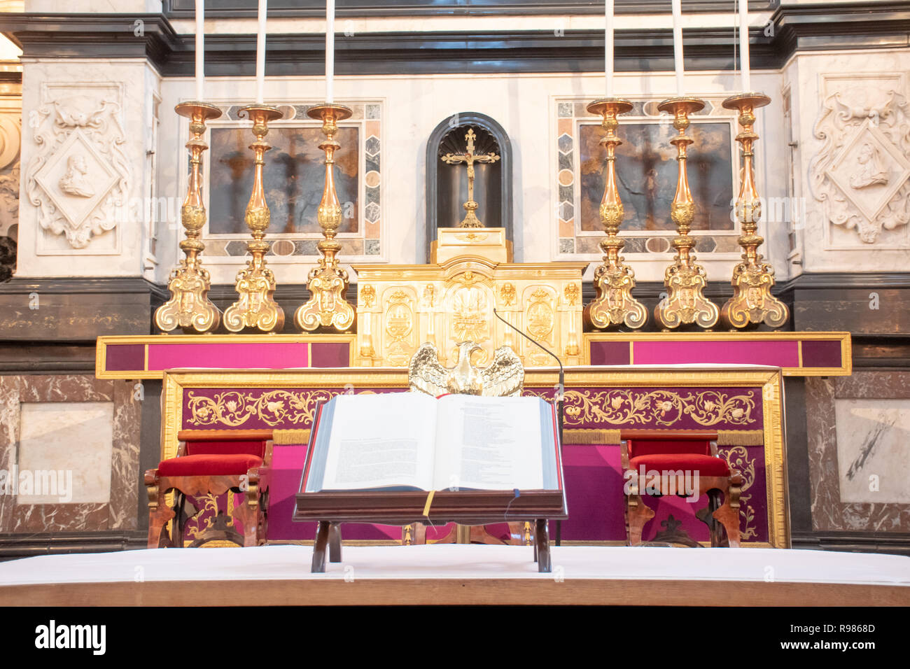 Bible overlooking Grand Altar in Cathedral with huge candles Stock ...