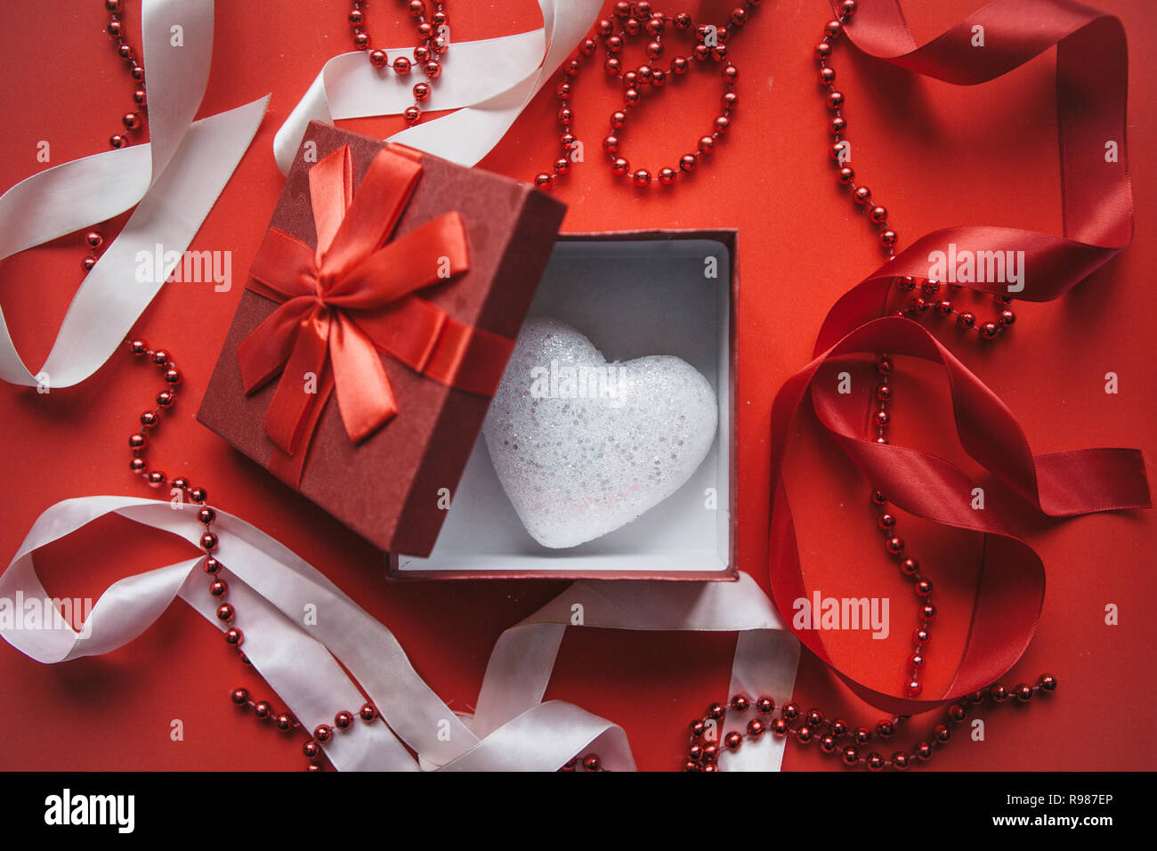 Red box and heart inside on red background. Concept for Valentine's Day ...