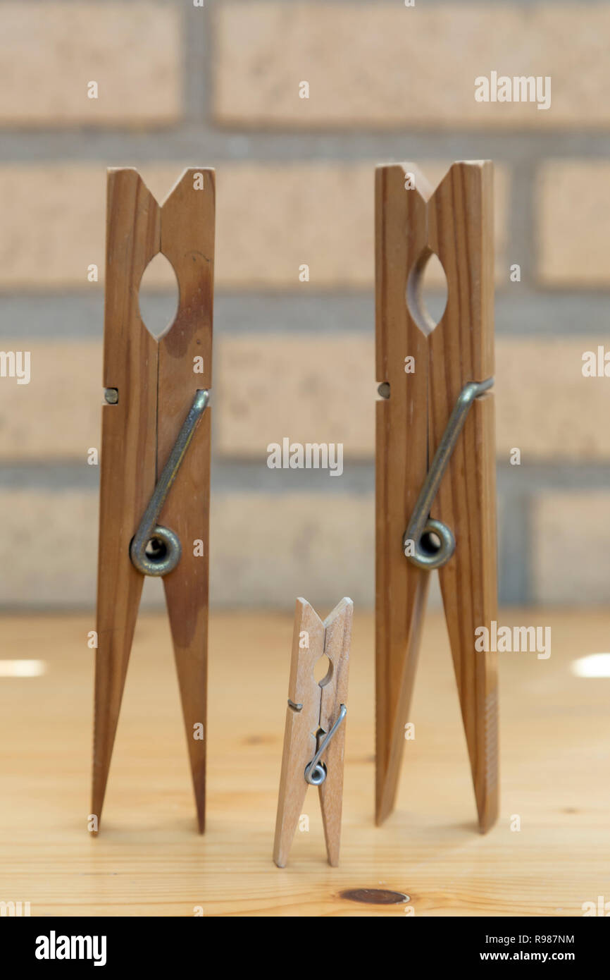 two large clamps next to a small clamp, big difference in size Stock ...